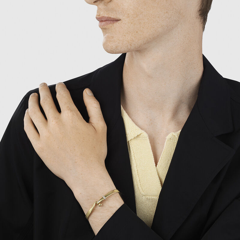 TORUN BANGLE 18ct. yellow gold bangle w. brilliant cut diamonds