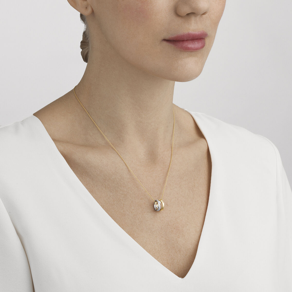 Fusion open pendant in 18kt yellow and white gold | Georg Jensen